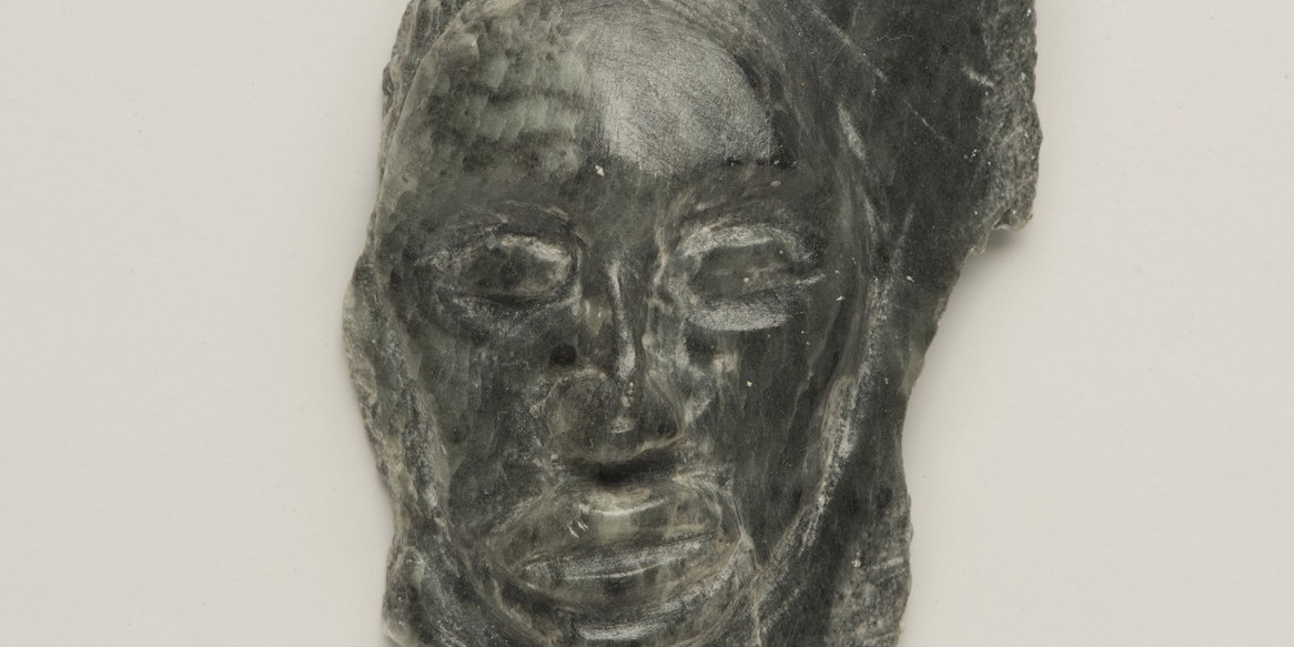 Carved Face in Relief · Brooklyn Museum