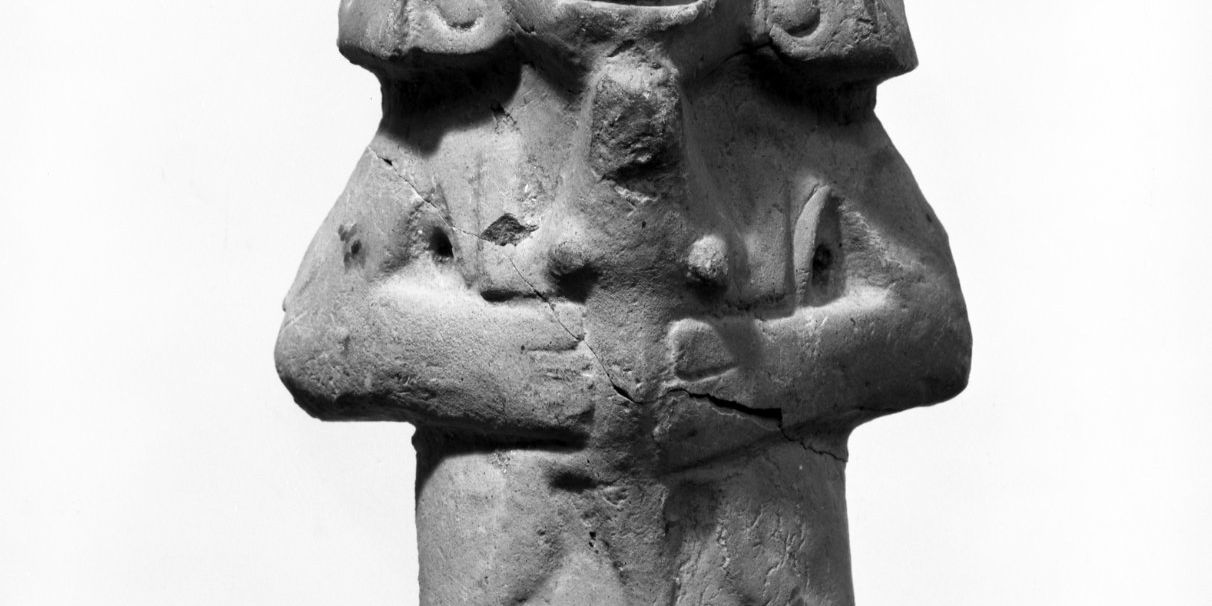 Figurine of Woman Holding Four-Legged Animal · Brooklyn Museum