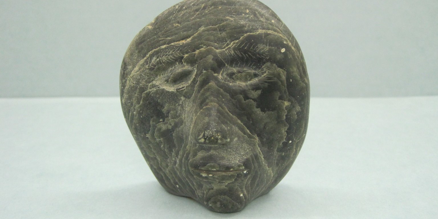Miniature Stone Head in Relief · Brooklyn Museum