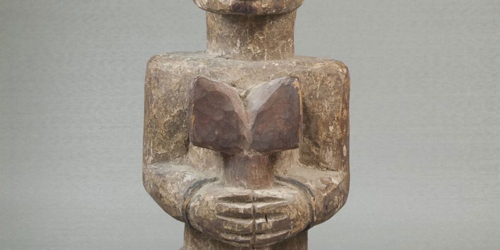 Figure of a Devotee of Shango Holding an Oshe Shango · Brooklyn Museum