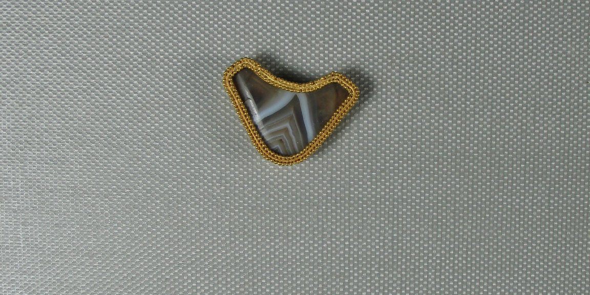 One of Eleven Triangular Stones · Brooklyn Museum