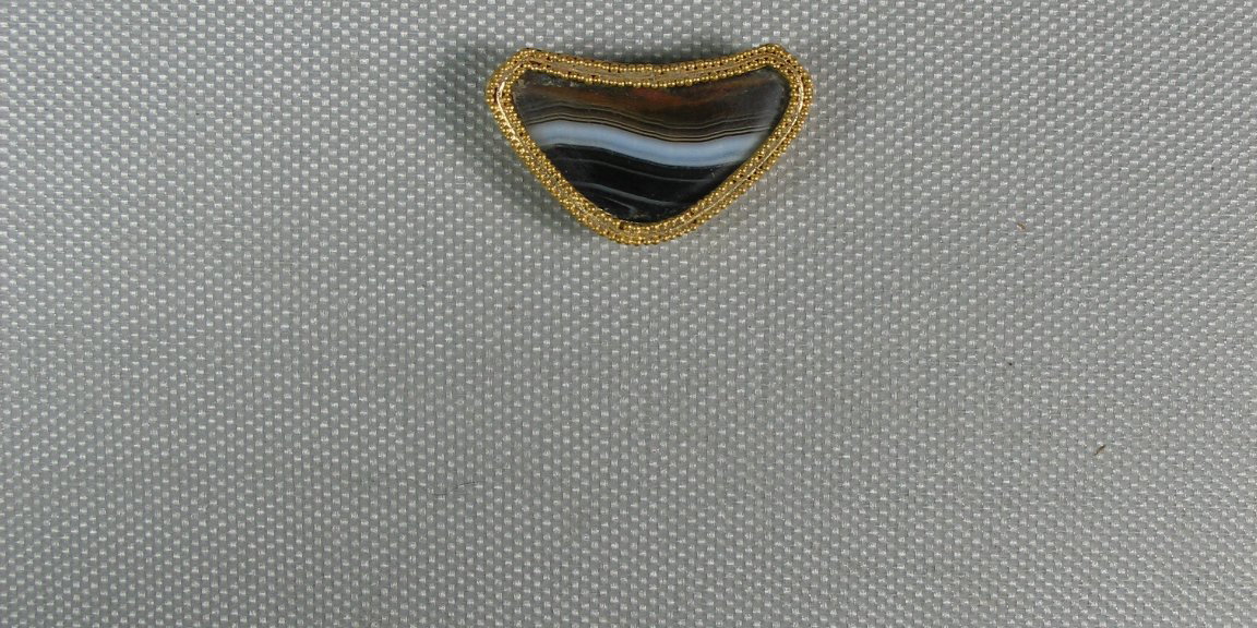 One of Eleven Triangular Stones · Brooklyn Museum